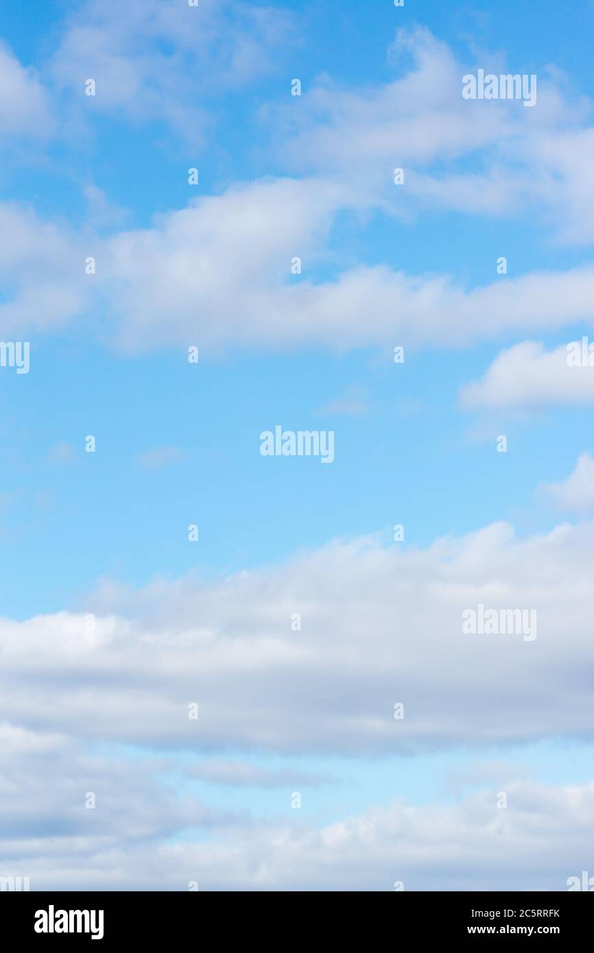 blue sky with flying white light clouds Stock Photo - Alamy
