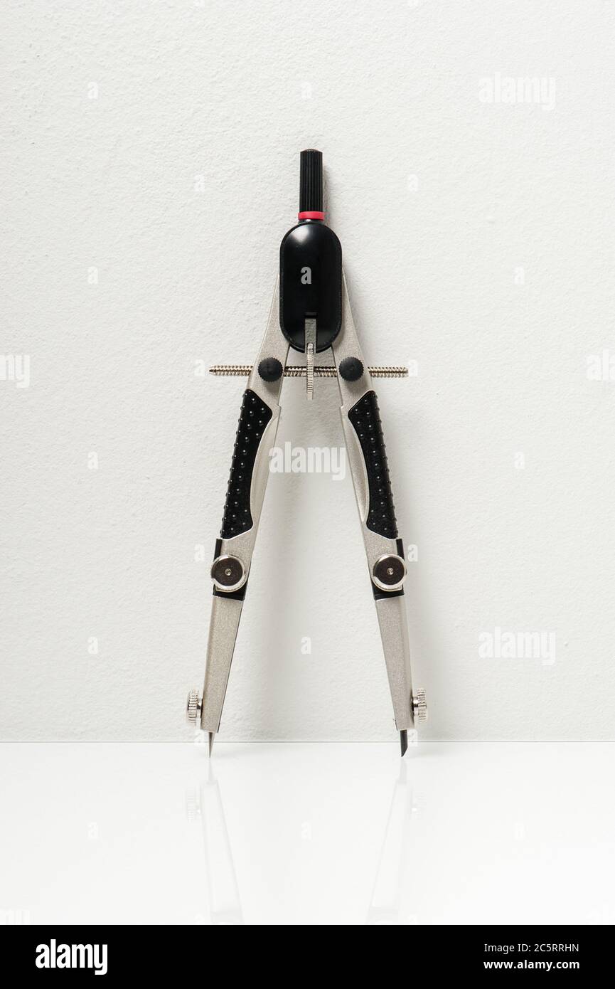 compasses isolated over white background, tool for industrial drawing ...