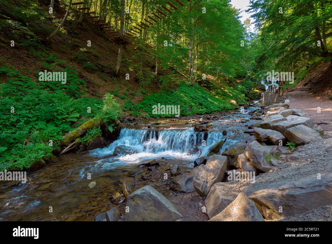 mountain river in the forest. fresh water stream from waterfall ...