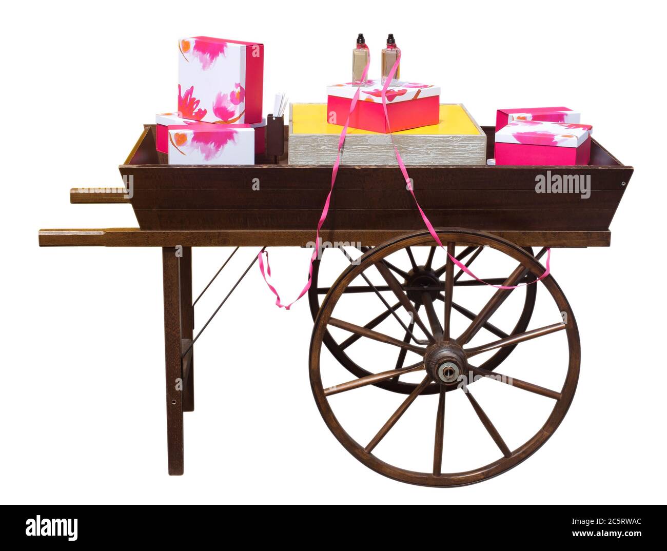 Wooden cart with gifts of perfume isolated on white. Clipping path ...