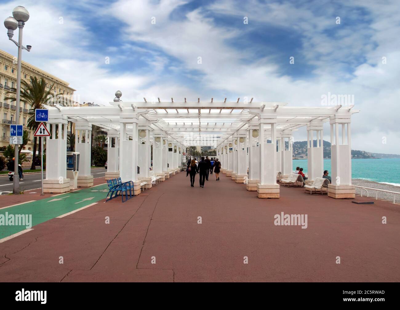 NICE, FRANCE - APRIL 27: Pedestrians walking on Promenade des Anglais ...