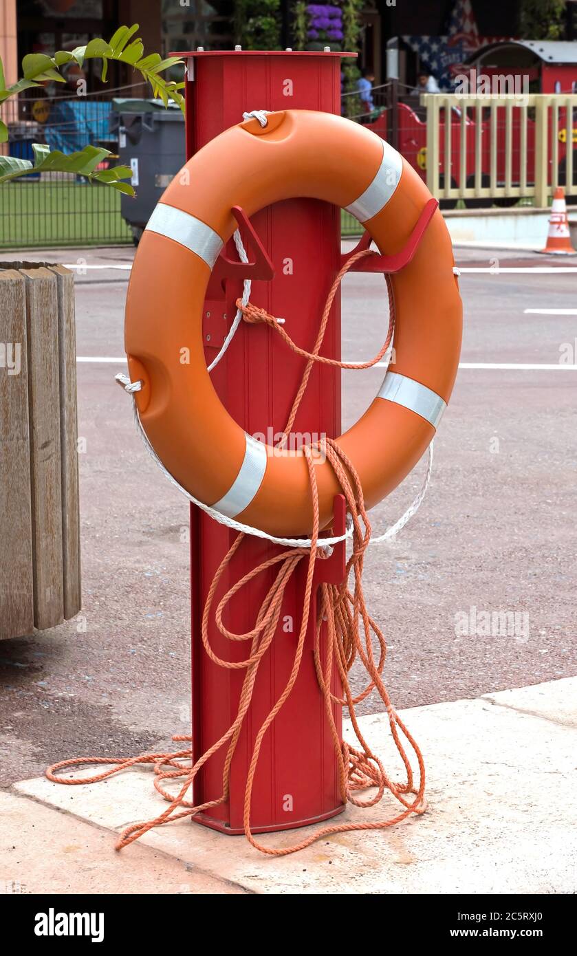 Lifebuoy on a rack in the port Stock Photo - Alamy