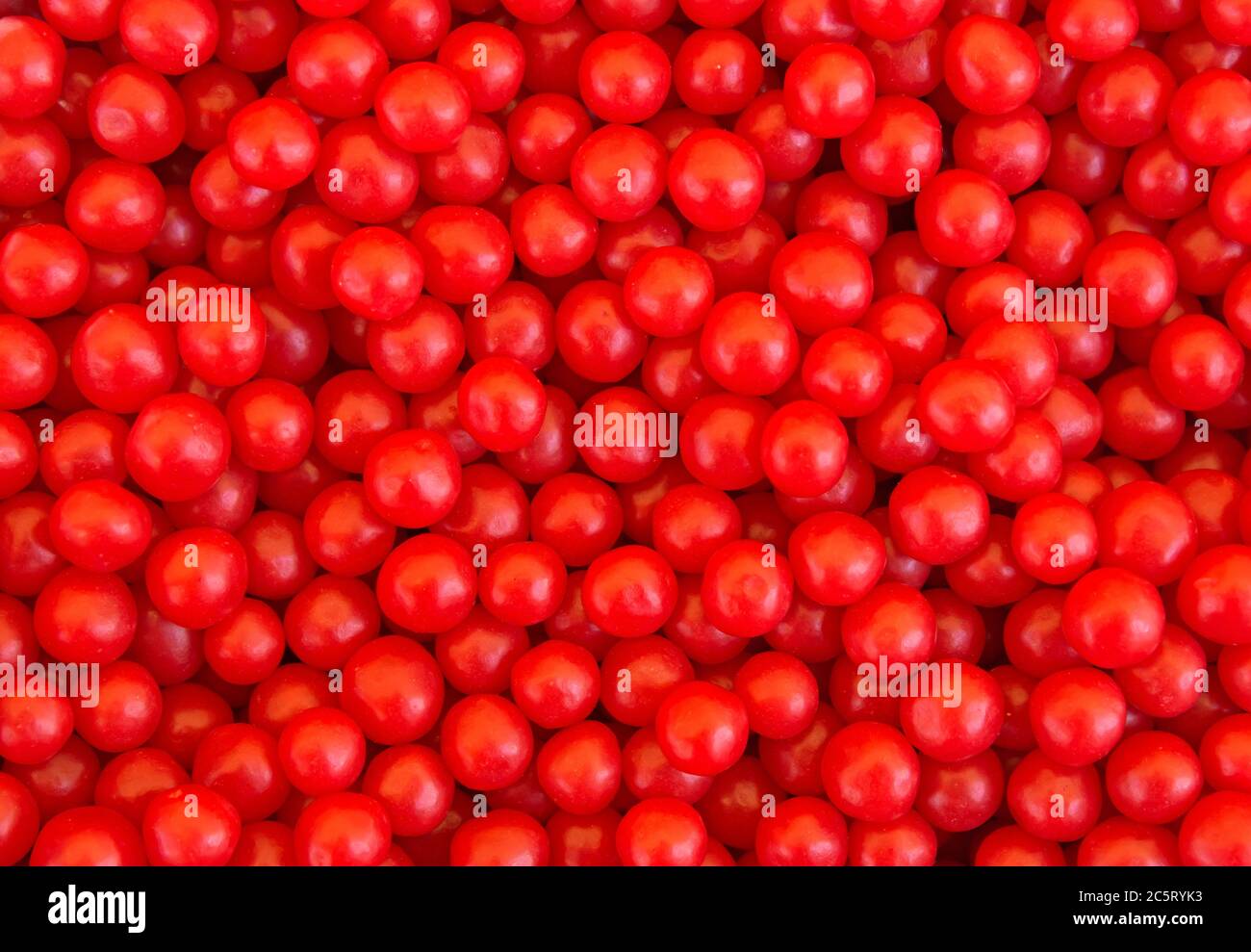 A lot of red candies for background Stock Photo - Alamy