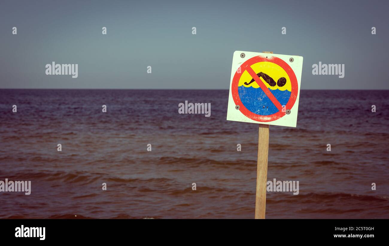 Swimming prohibited sign, Marking on the sea Stock Photo - Alamy