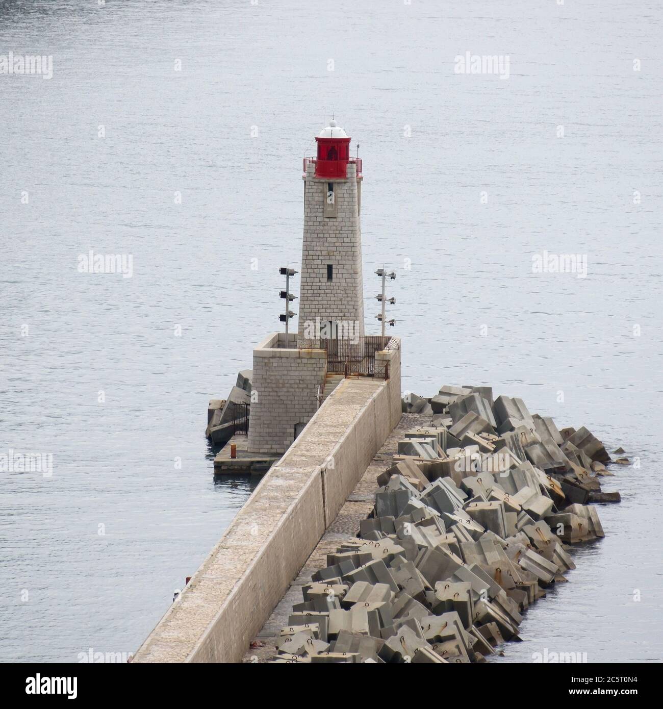 Lighthouse tower at port entrance in Nice Stock Photo - Alamy