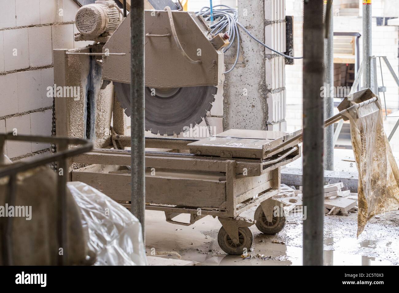 Concrete cutting machine during construction Stock Photo - Alamy