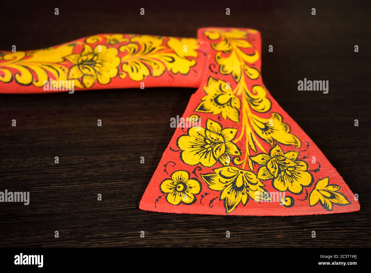 axe in Khokhloma. An axe painted in Russian folk style. Russian ...