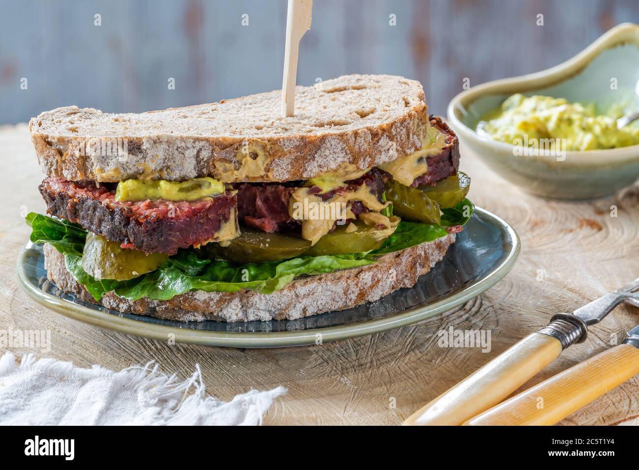 Salt beef sandwich with pickled cucumber and mustard tartar sauce Stock ...
