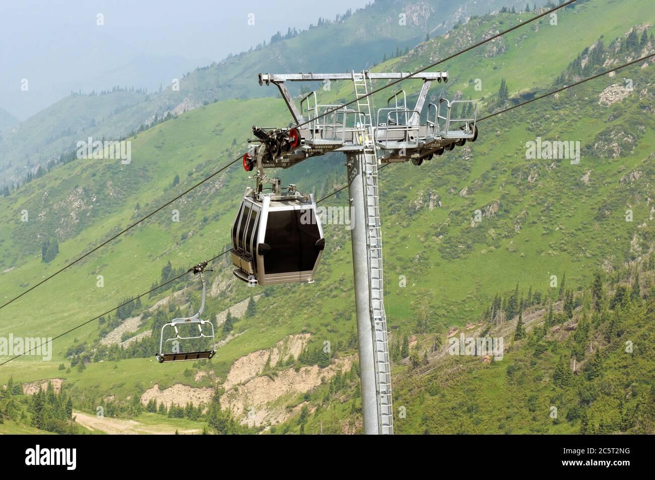 Cable car through Alps mountains in the summer Stock Photo - Alamy