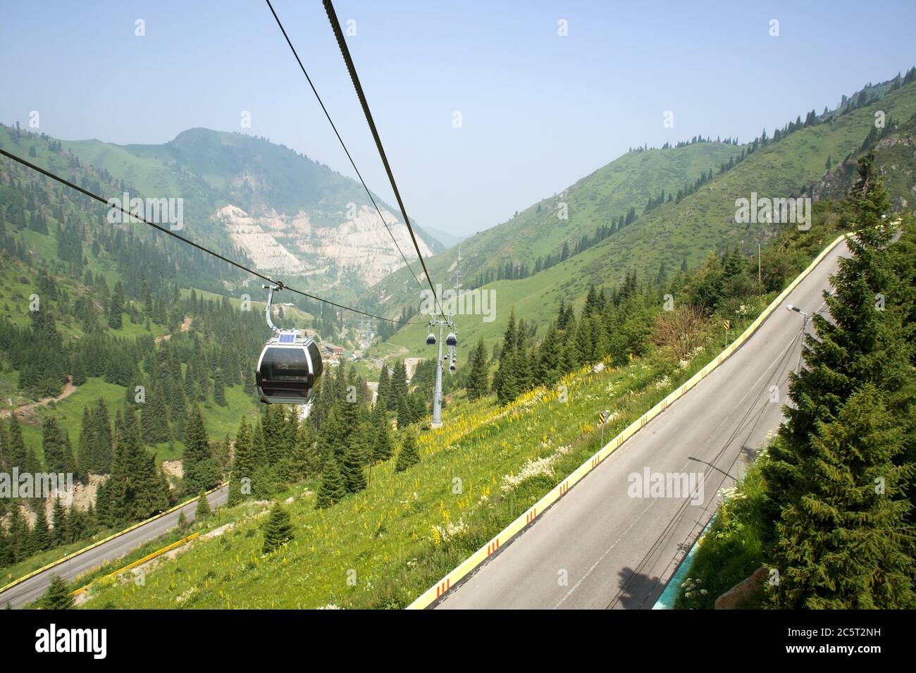 Cable car and car-way through Alps mountains in the summer Stock Photo ...