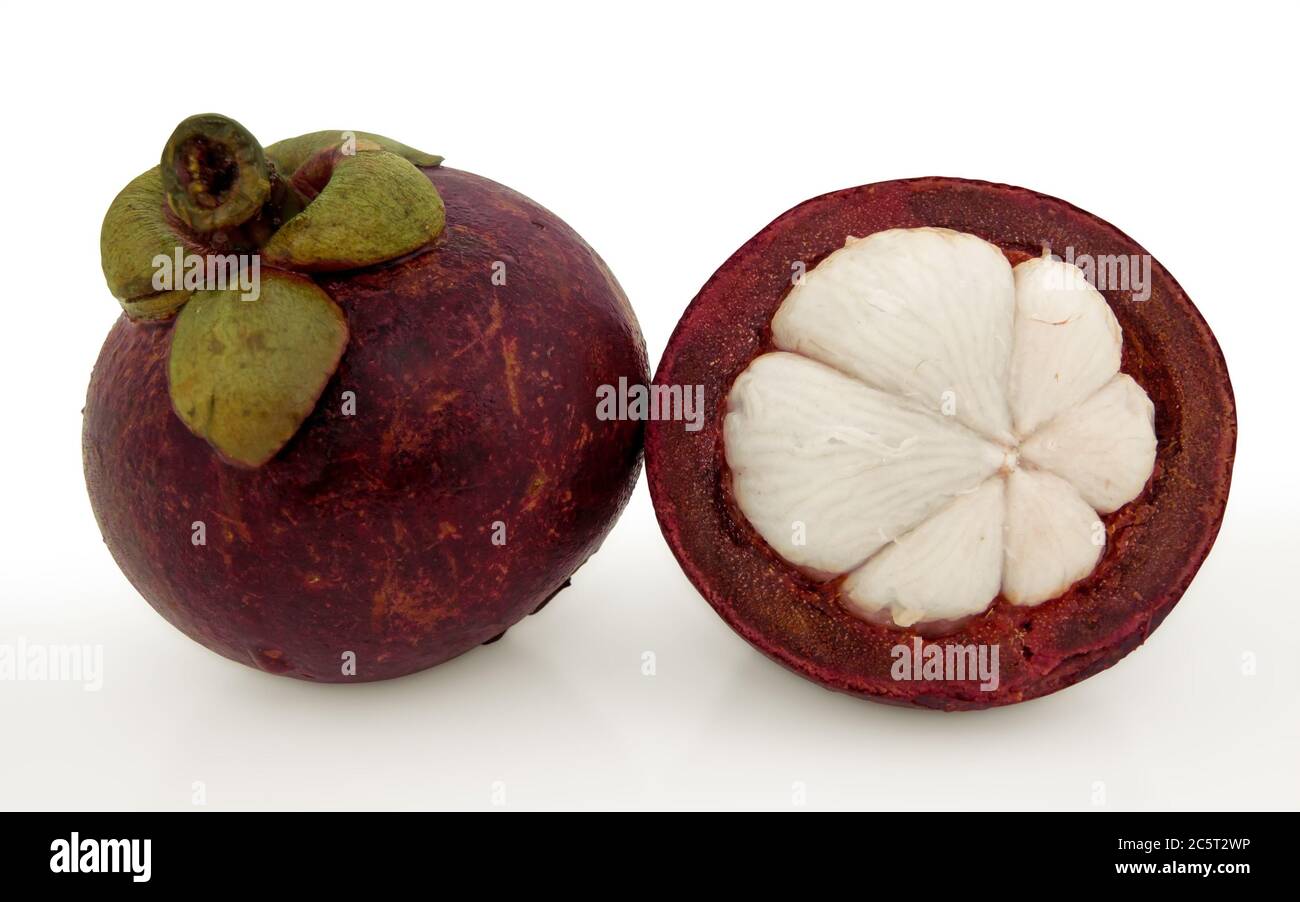 Mangosteen and cross section isolated on white. Clipping path included ...