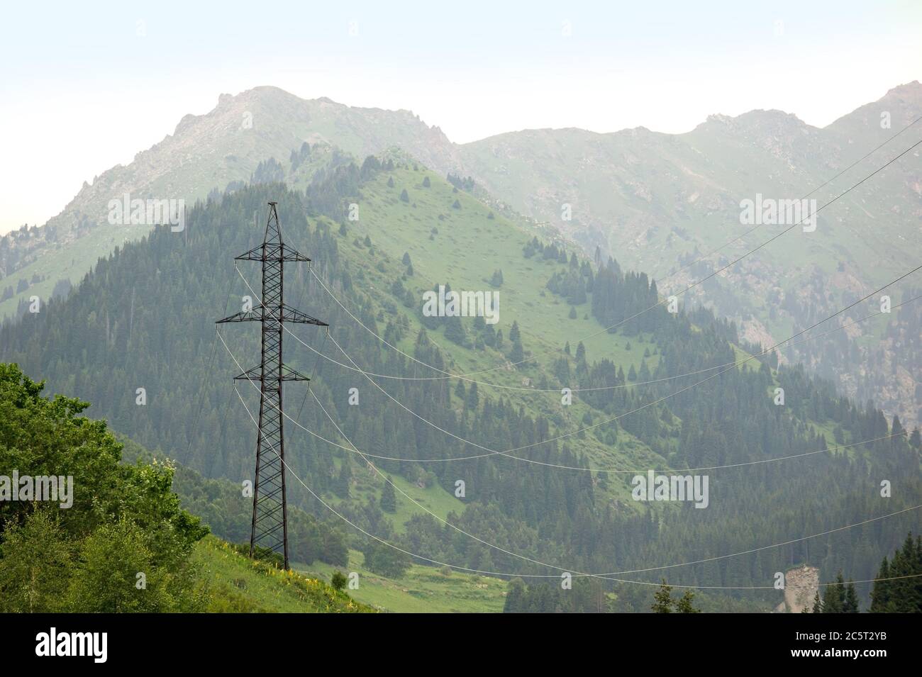 High-voltage power line through Alps mountains Stock Photo - Alamy