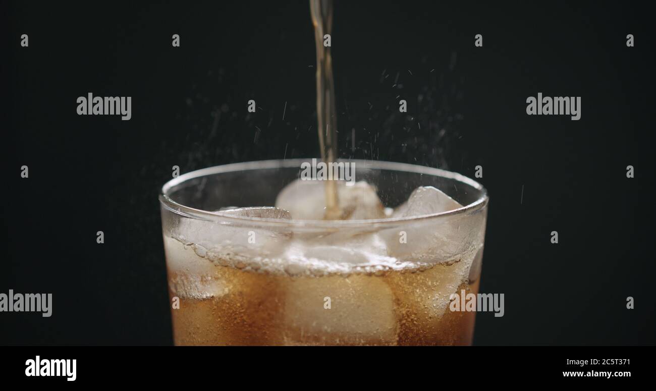 Slow motion cola pouring glass hi-res stock photography and images - Alamy