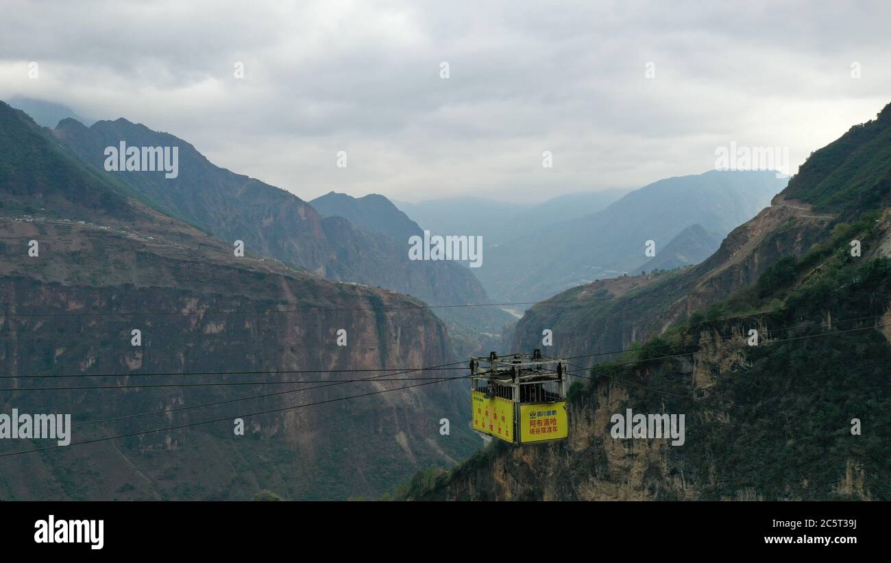 Butuo. 5th July, 2020. Aerial photo taken on May 11, 2020 shows a cable ...