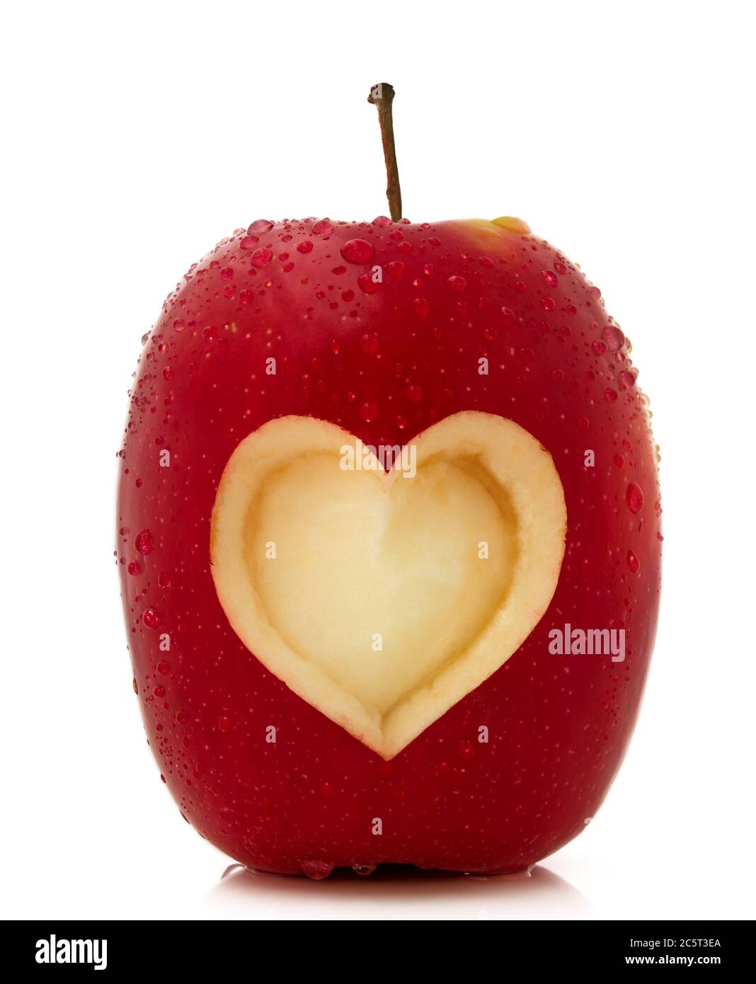 Red apple with a heart symbol isolated on white background Stock Photo ...