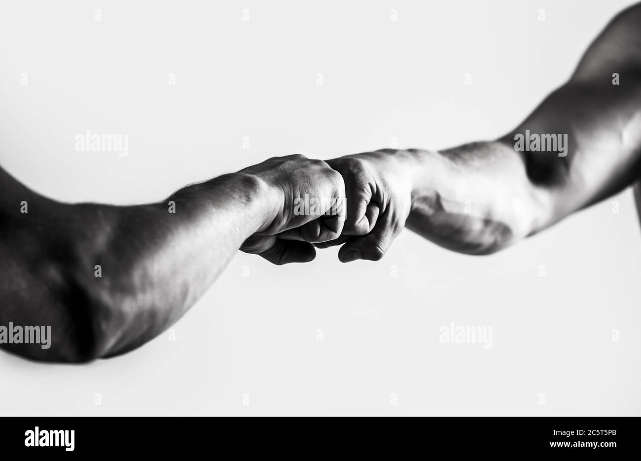 Friendly handshake, friends greeting. Hands of man people fist bump ...