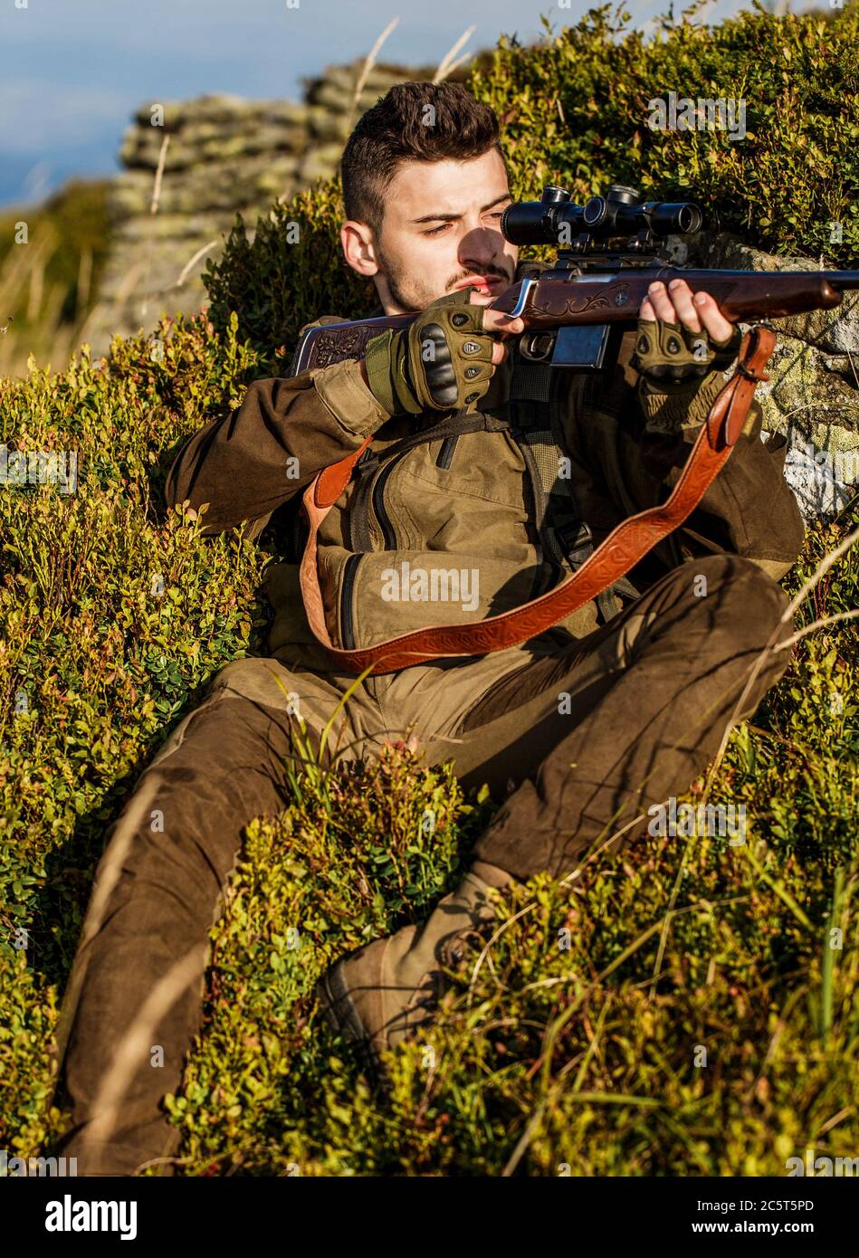 Hunt hunting rifle. Hunter man. Hunting period. Male with a gun. Close ...