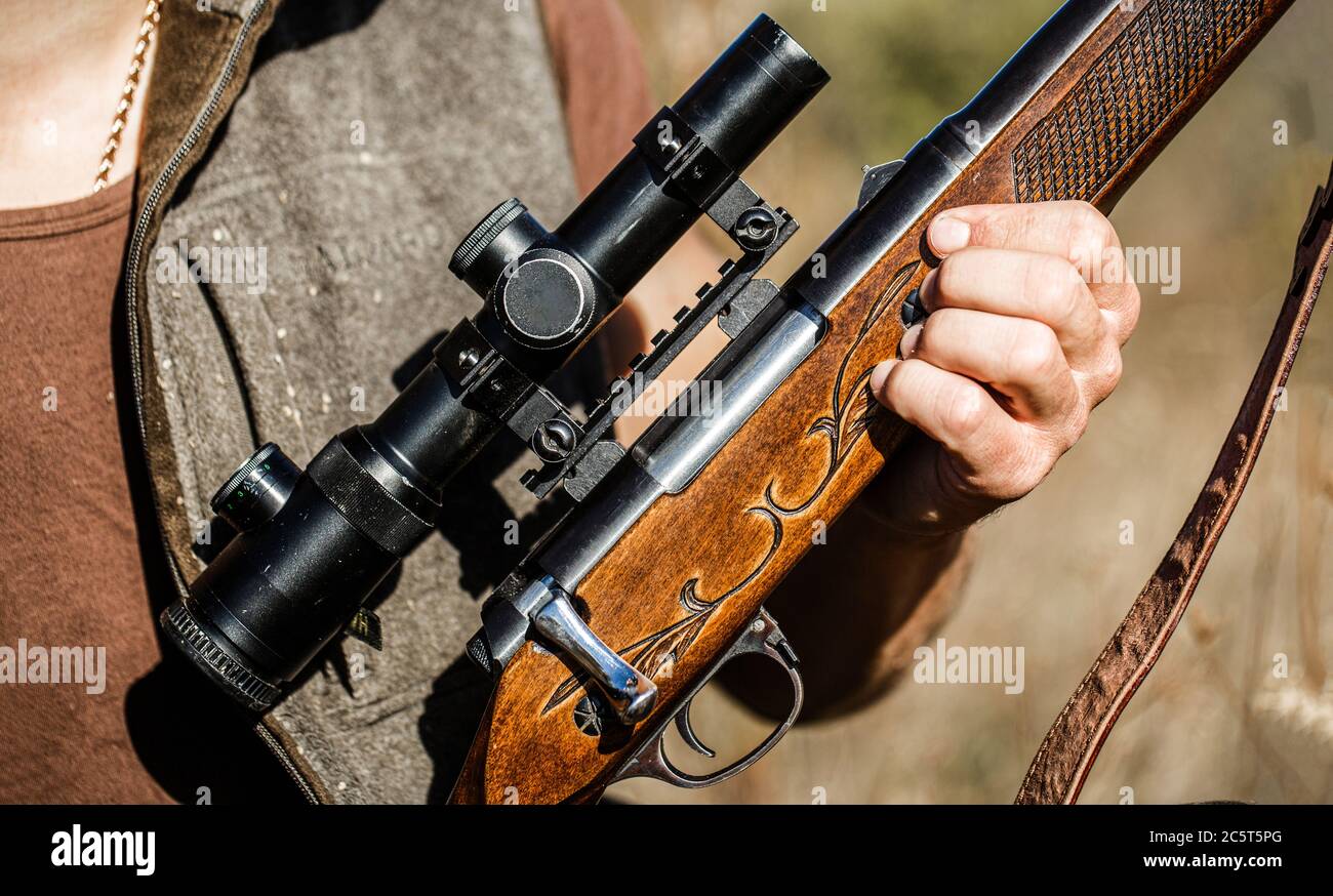 Male with a gun, rifle. Process of hunting during hunting season. Male ...