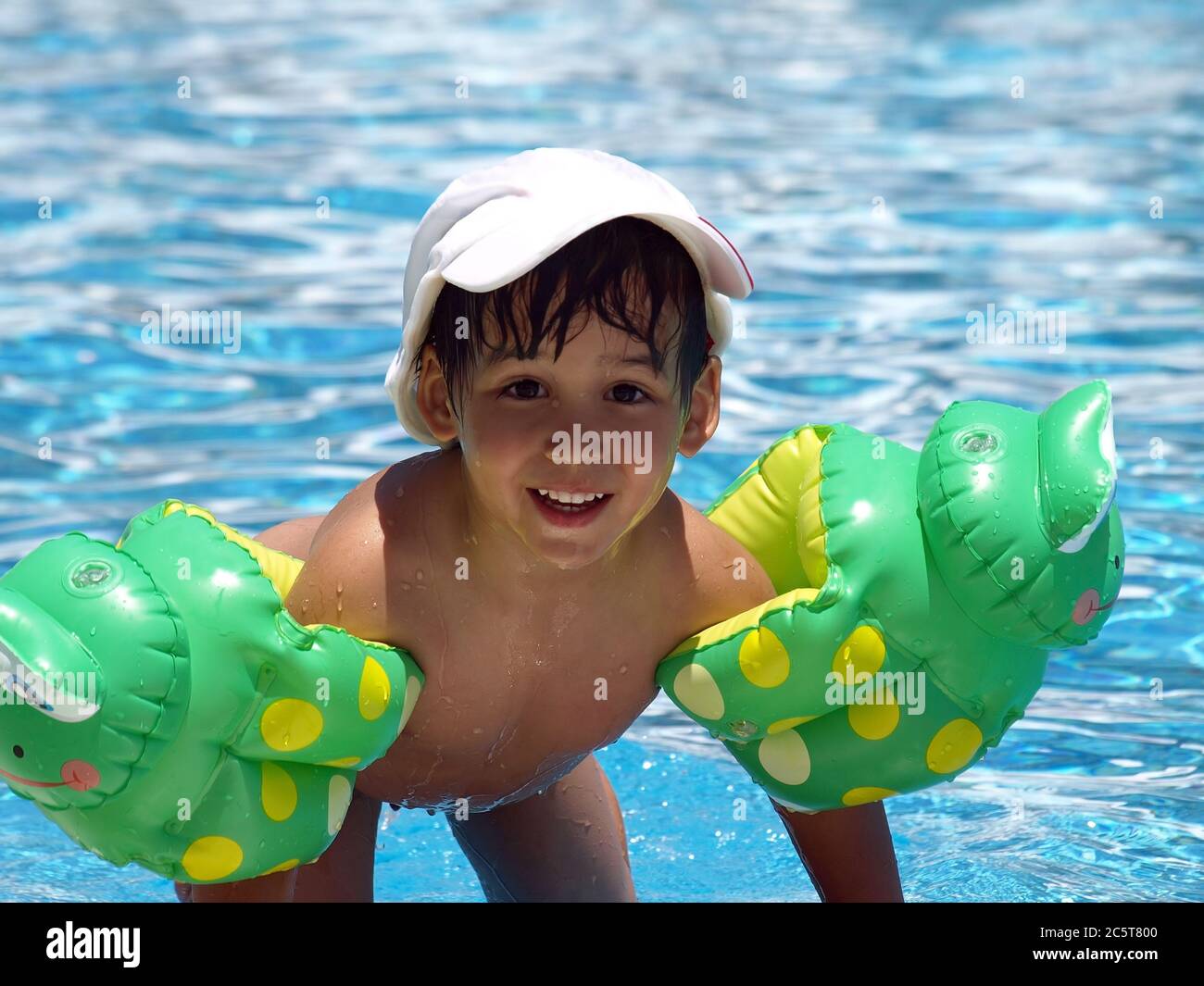 Little boy after swimming in the family pool Stock Photo - Alamy