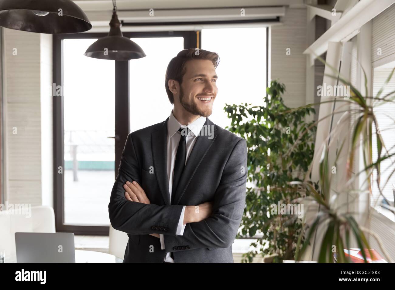 Overjoyed young businessman in suit hi-res stock photography and images ...