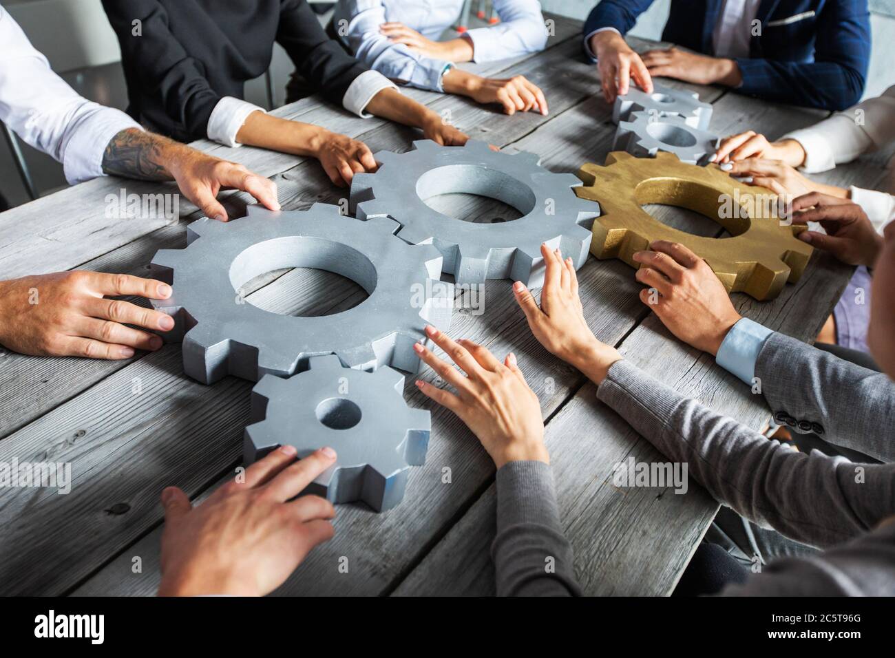 Business people teamwork gear together hi-res stock photography and ...