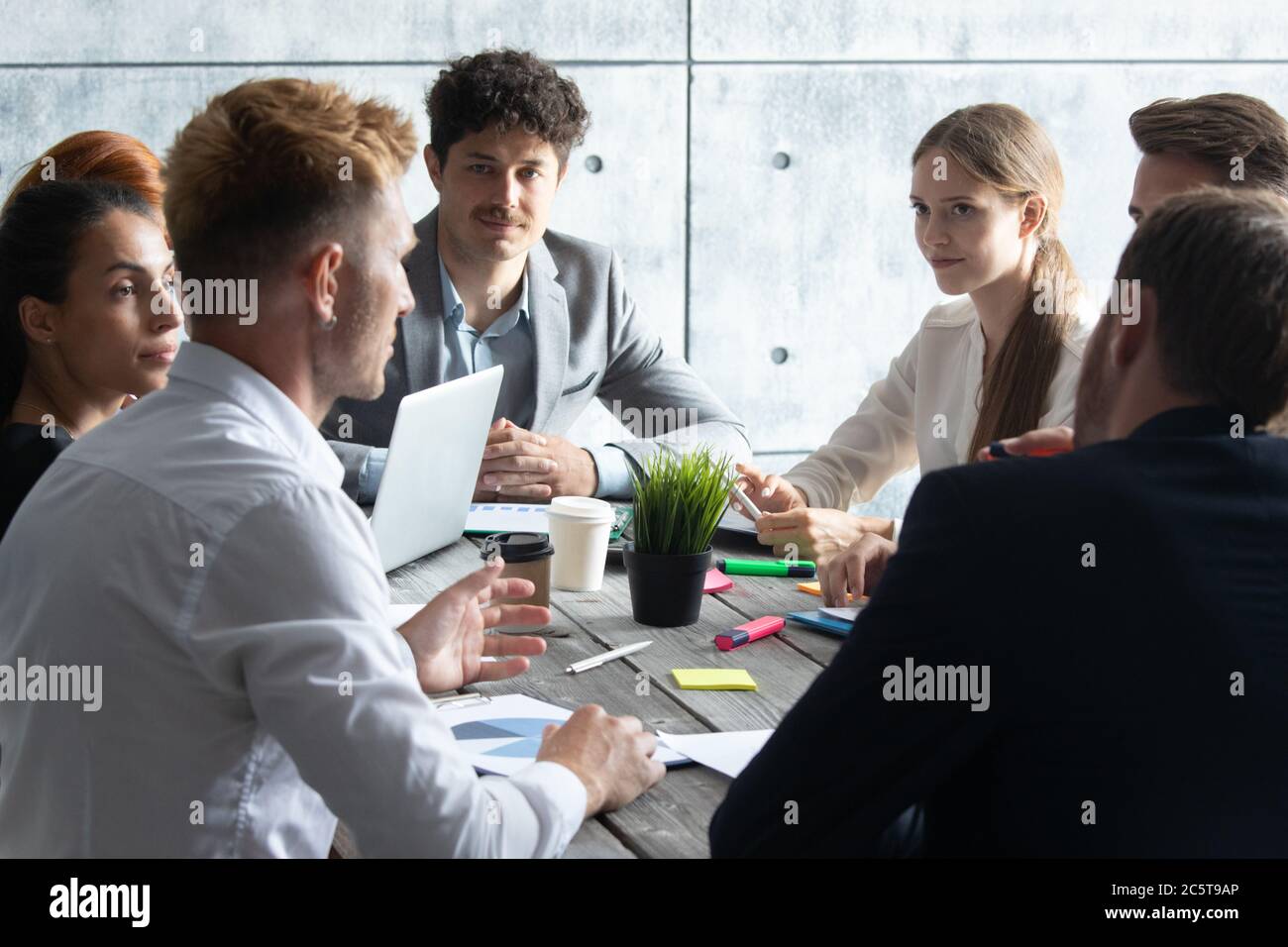 Diverse business people discussing documents hi-res stock photography ...
