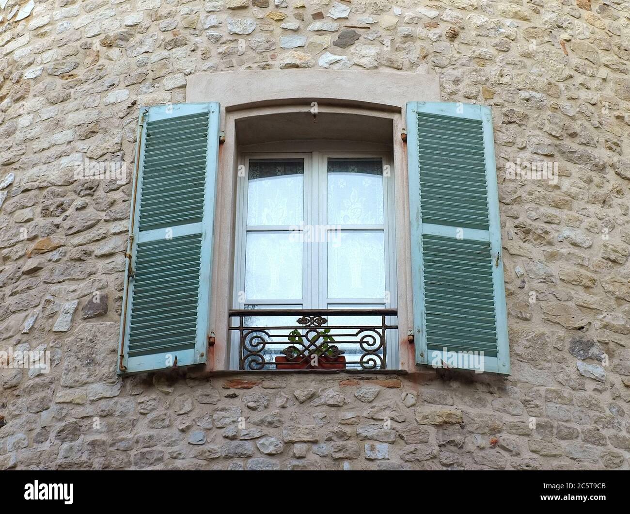Window on medieval stone wall - Antibes, France Stock Photo - Alamy