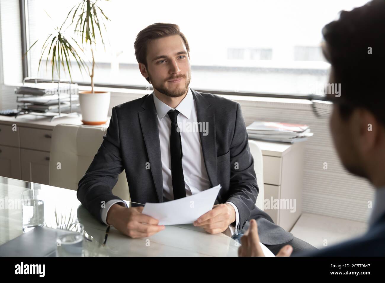 Caucasian businessman consider paperwork hi-res stock photography and ...