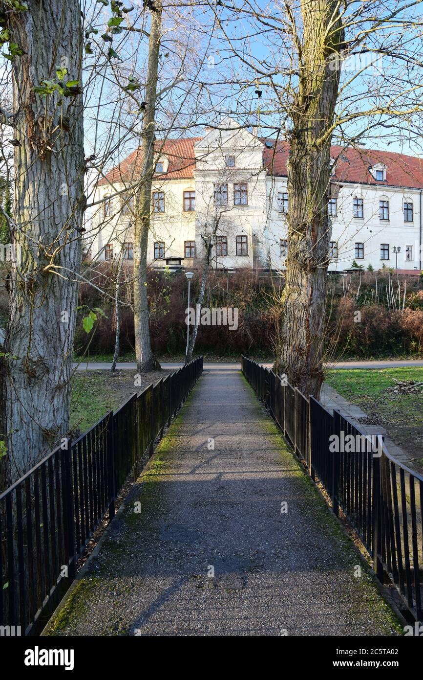 A path across the bridge leads to the old castle. Spring Stock Photo ...