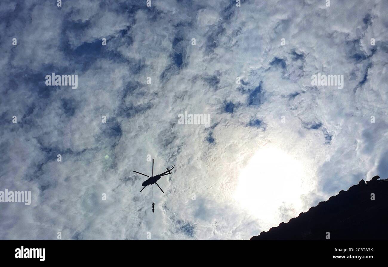 Kathmandu, Nepal. 5th July, 2020. Nepali Army personnel hang beneath a ...
