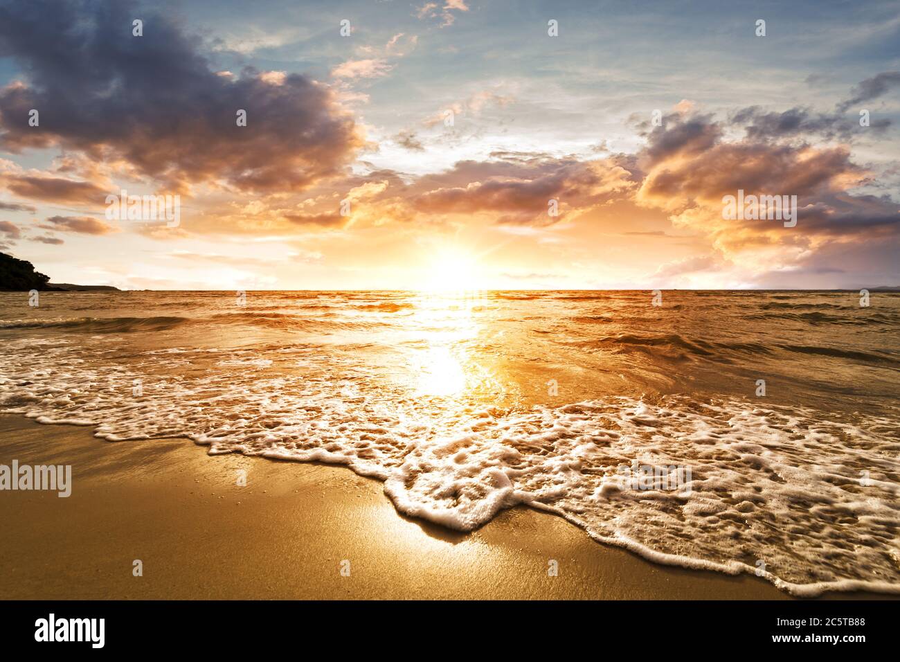The beach with sunset and cloud in golden hours Stock Photo - Alamy