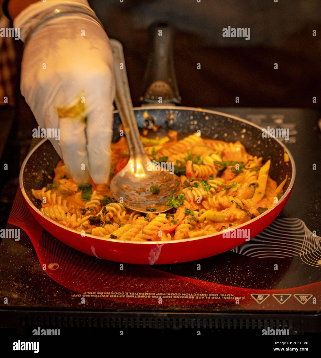 Chef cooks pasta in frying hi-res stock photography and images - Alamy