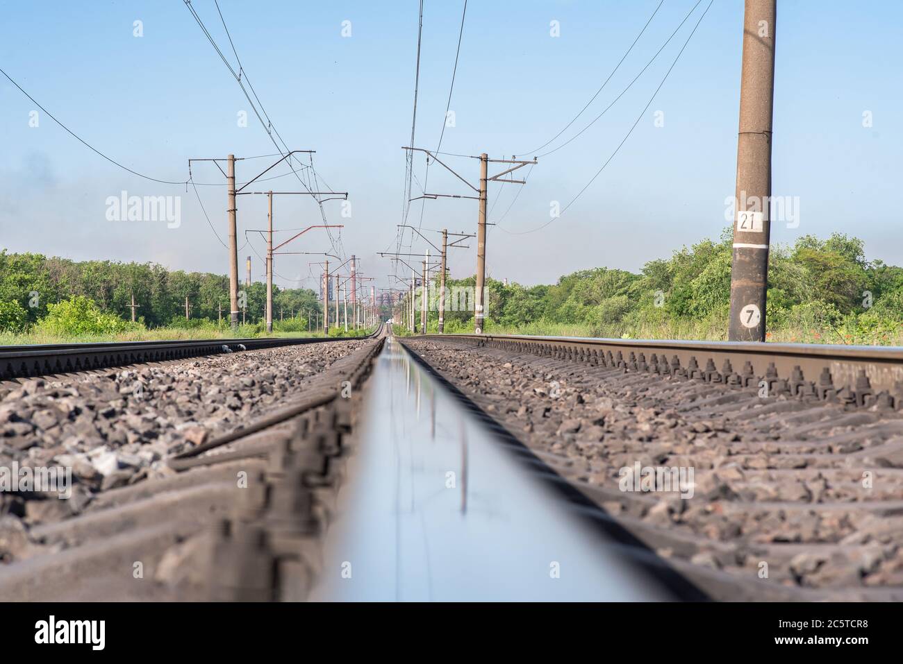 The railway line running to the plant. Railroad tracks going through ...