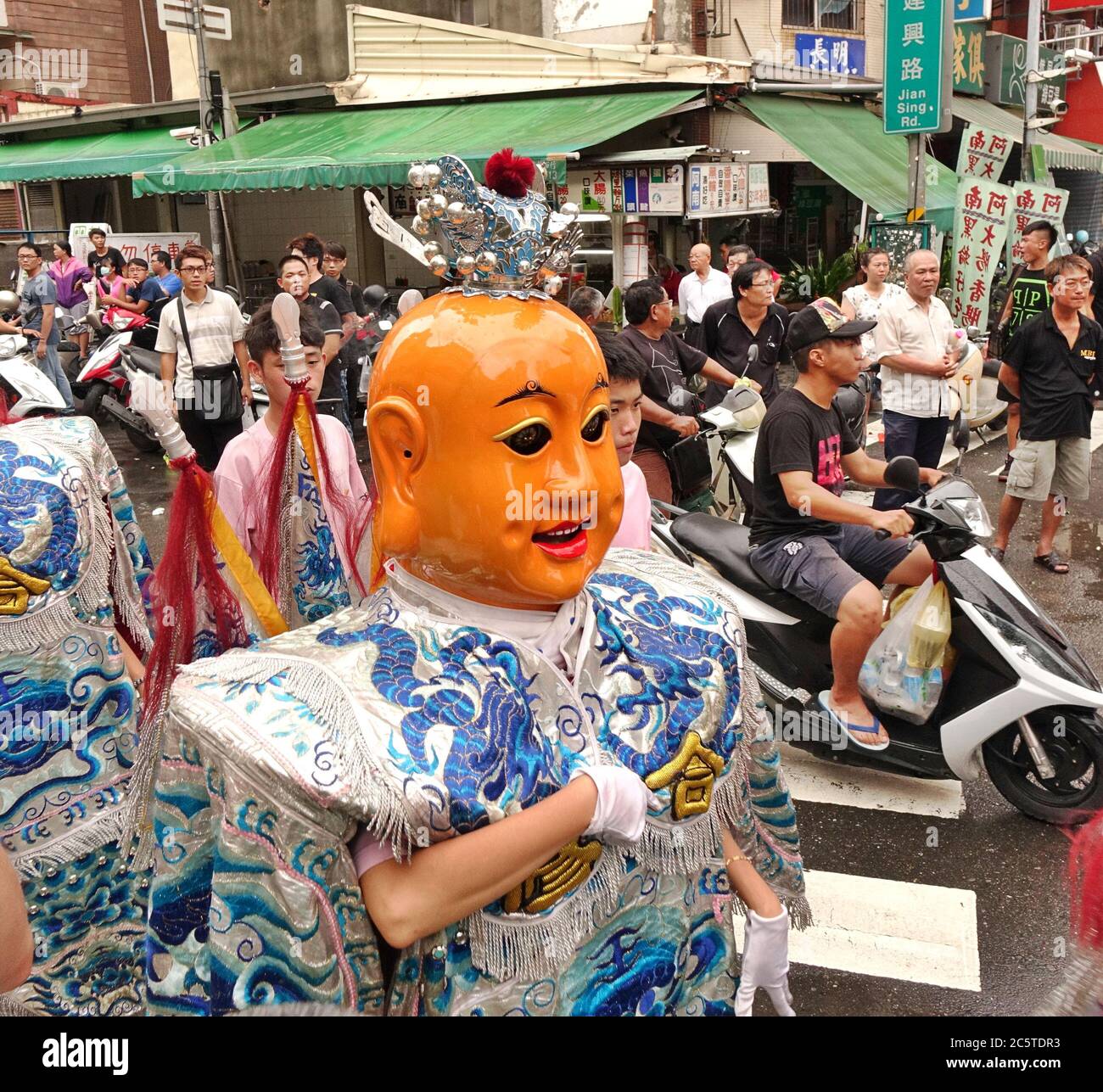 KAOHSIUNG, TAIWAN -- JULY 9, 2016: Male dancers with head covering ...