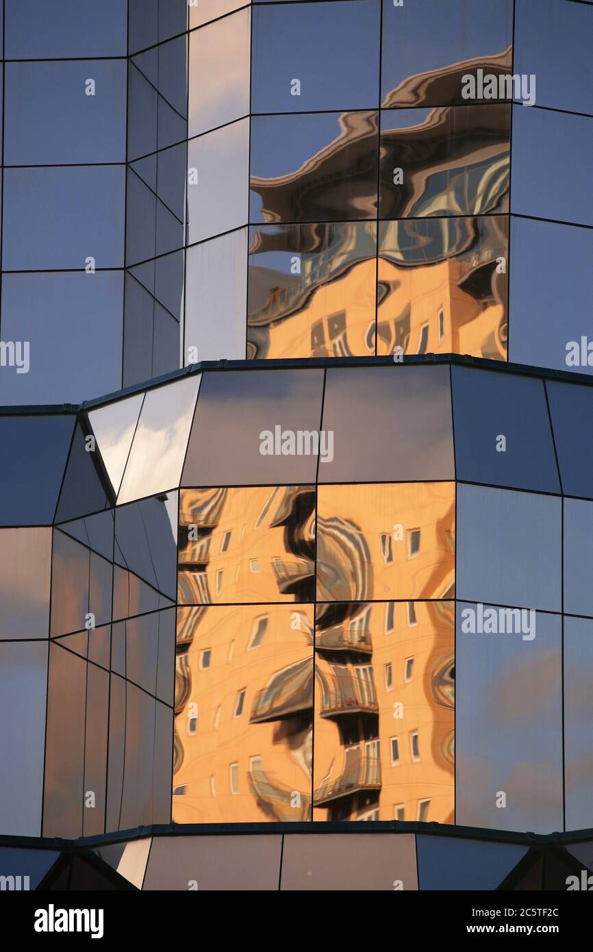 Quay West: glass building reflecting the Milennium Bridge and Riverside ...