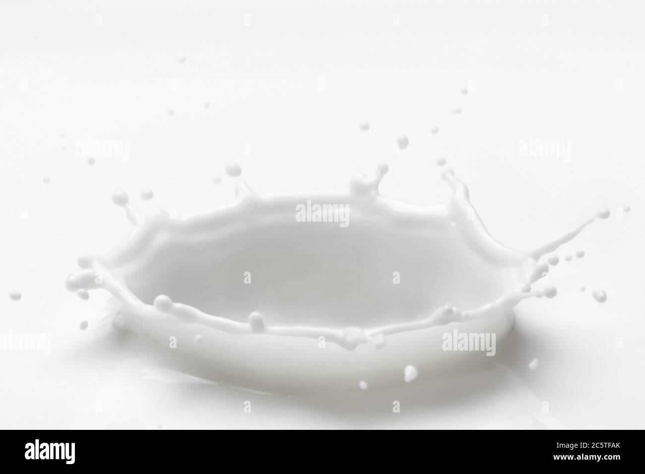 Milk splash with high speed photography.Pouring milk splash isolated on ...