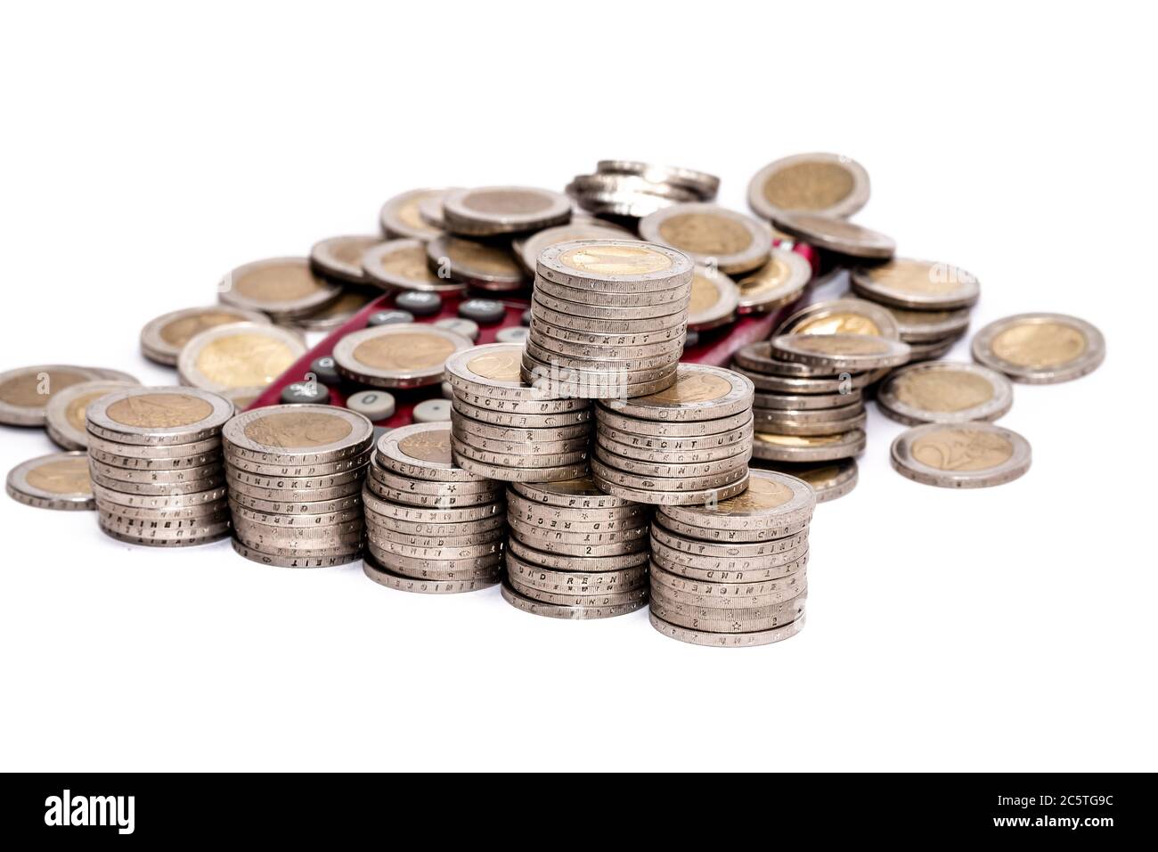 Euro coins money stack and single coins scattered over a pocket ...