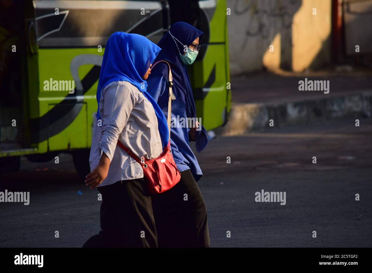 women go to work wearing masks Stock Photo - Alamy