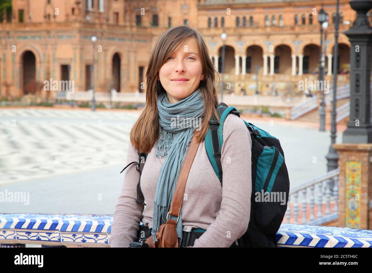 Female backpacker visits Seville, Spain. European backpacking adventure ...