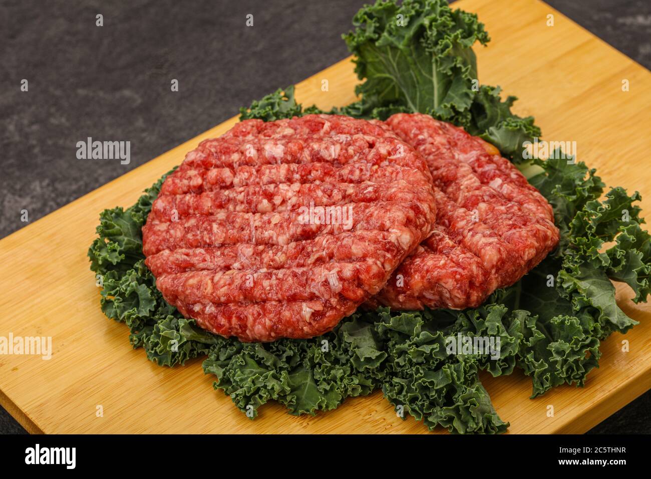 Raw beef burger cutlet for grill Stock Photo - Alamy