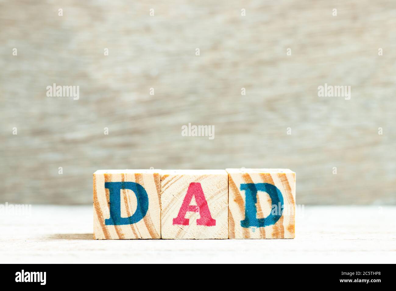 Alphabet letter in word dad on wood background Stock Photo - Alamy