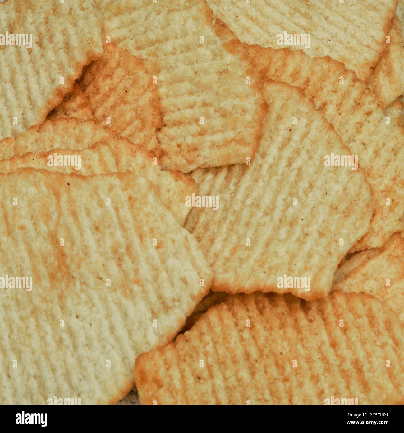 Corrugated Potato Chips. Snack, junk food. Close up Stock Photo - Alamy
