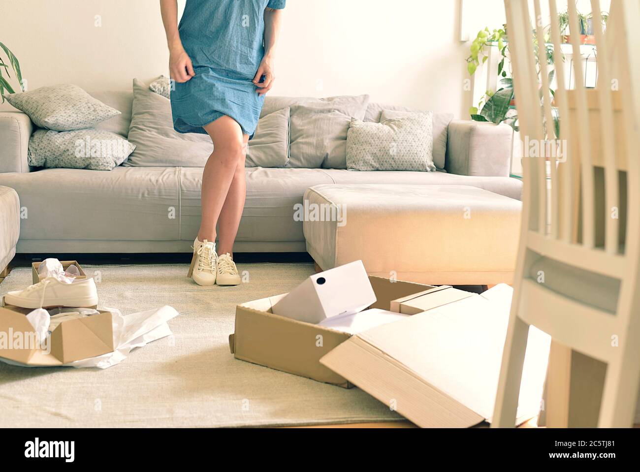 adult woman trying on sneakers shoes in front of a mirror Stock Photo ...