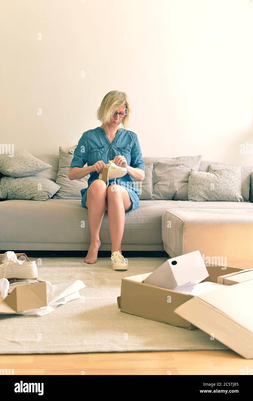 Woman trying on shoes in hi-res stock photography and images - Alamy