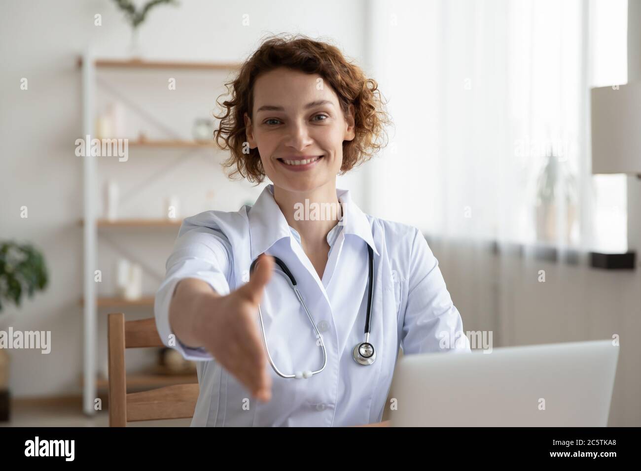 Portrait of smiling female doctor stretch hand for handshake Stock ...