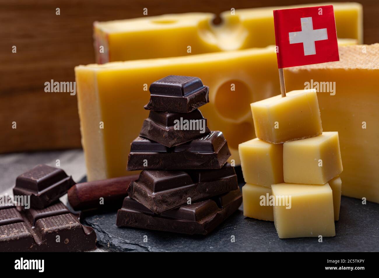 Tasty Swiss food, block of medium-hard yellow cheese emmental or ...