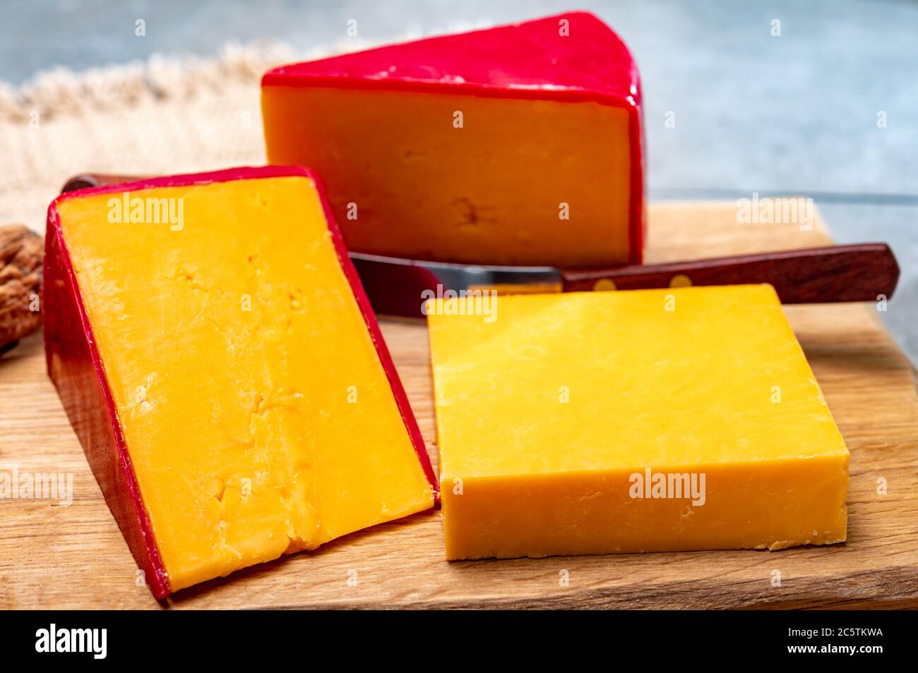 British red waxed yellow cheddar cheese close up Stock Photo - Alamy