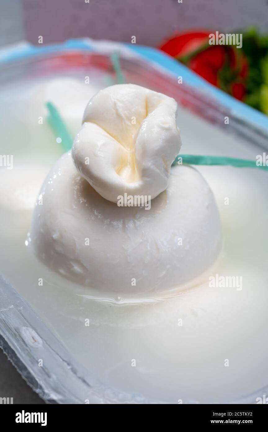 Fresh handmade soft Italian cheese from Puglia, white balls of burrata ...