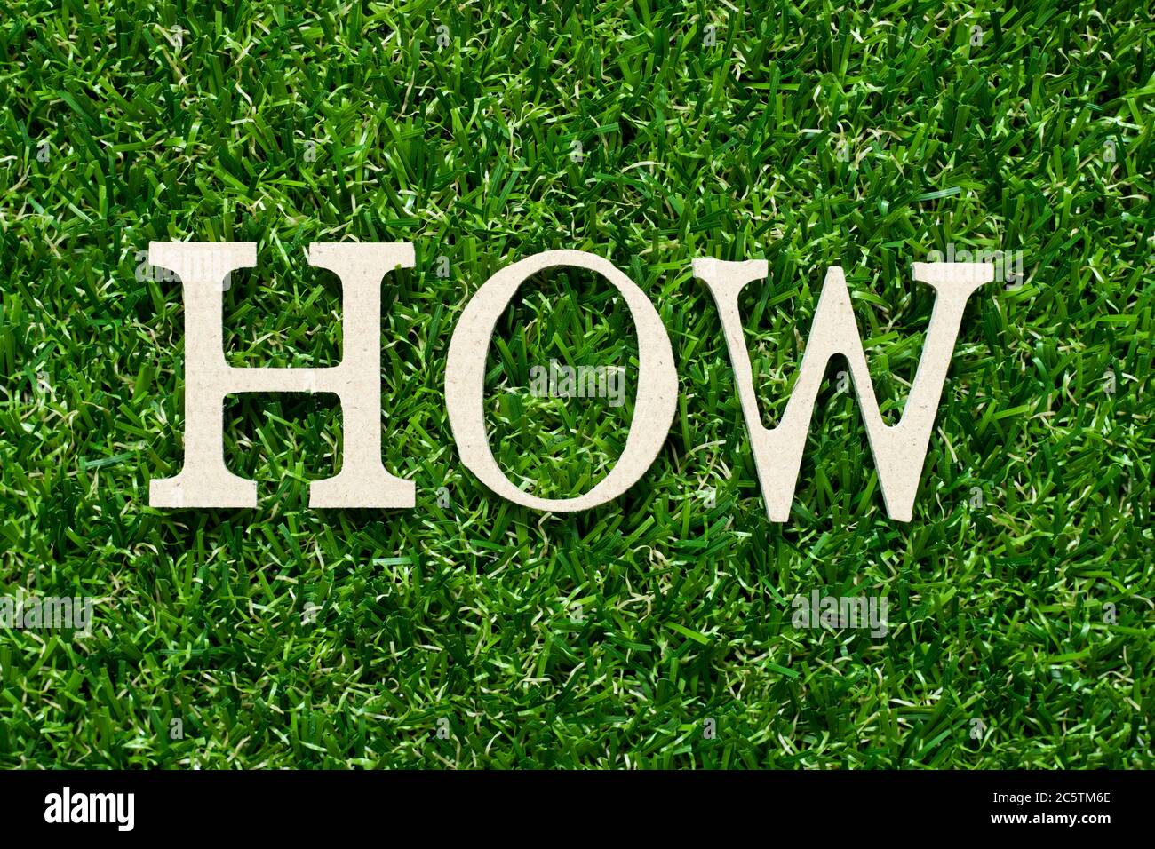 Wood alphabet letter in word how on green grass background Stock Photo ...