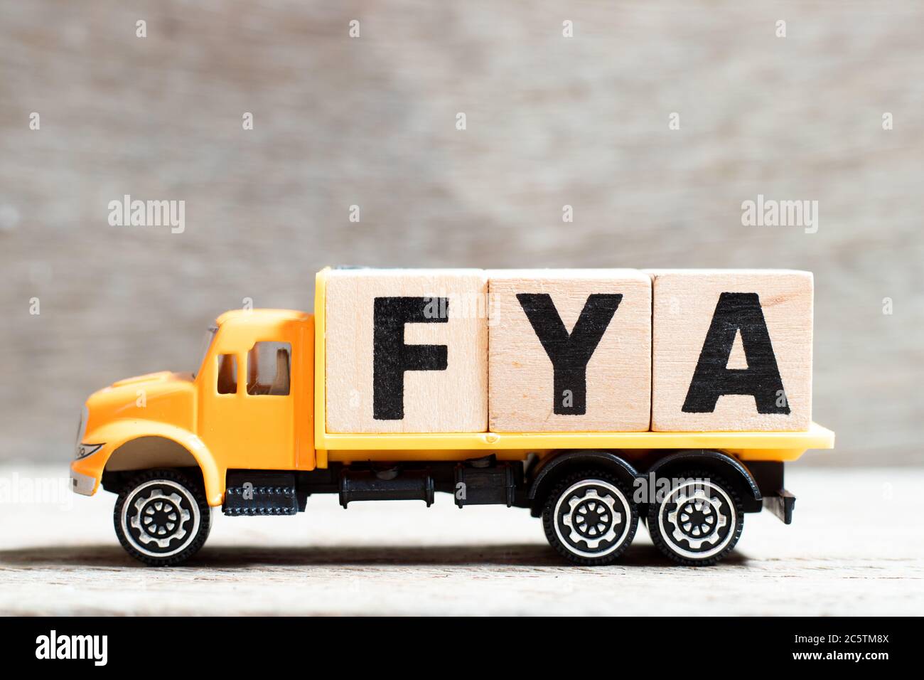 Truck hold letter block in word FYA (Abbreviation of For your action or ...